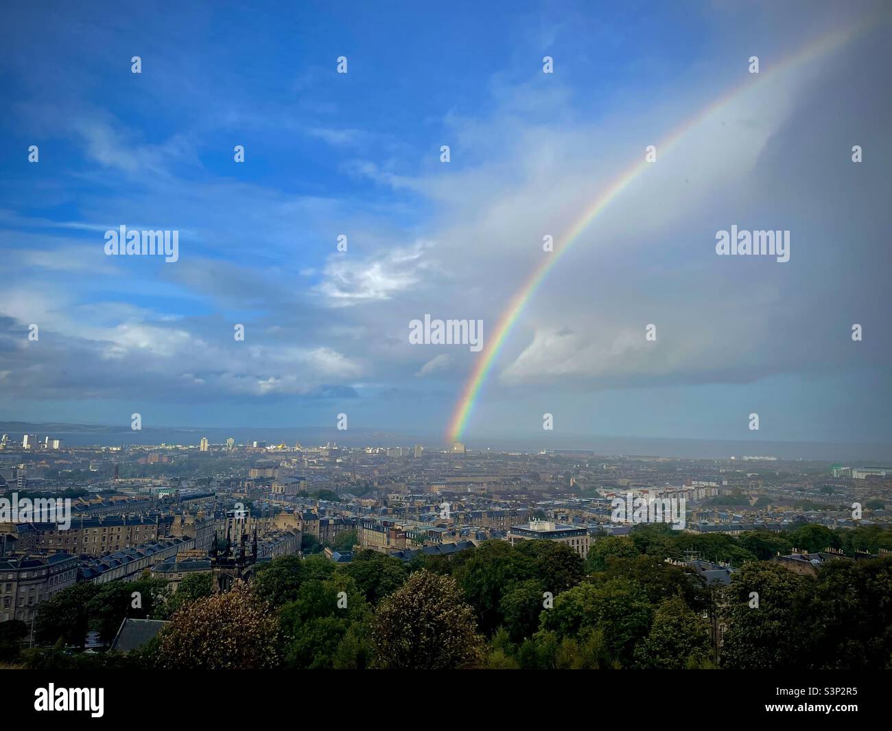 A rainbow lands on Leith, Edinburgh, Scotland, UK, from a view on ...