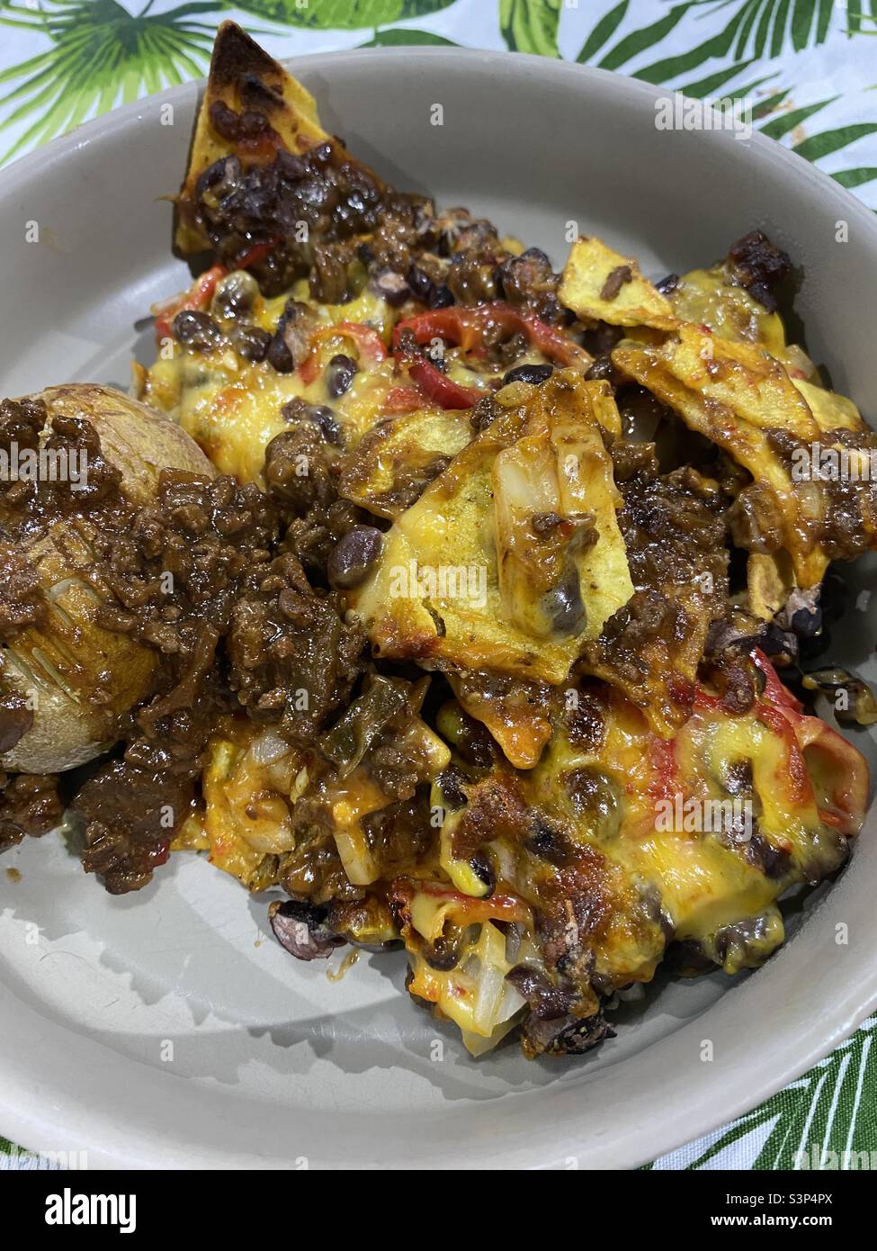 Home made mince Nachos and cheese Jacket Spud Stock Photo - Alamy