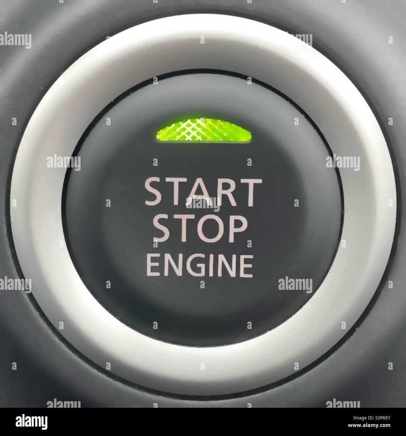 ‘Push the button’ A push start button is pressed and the car engine is ...