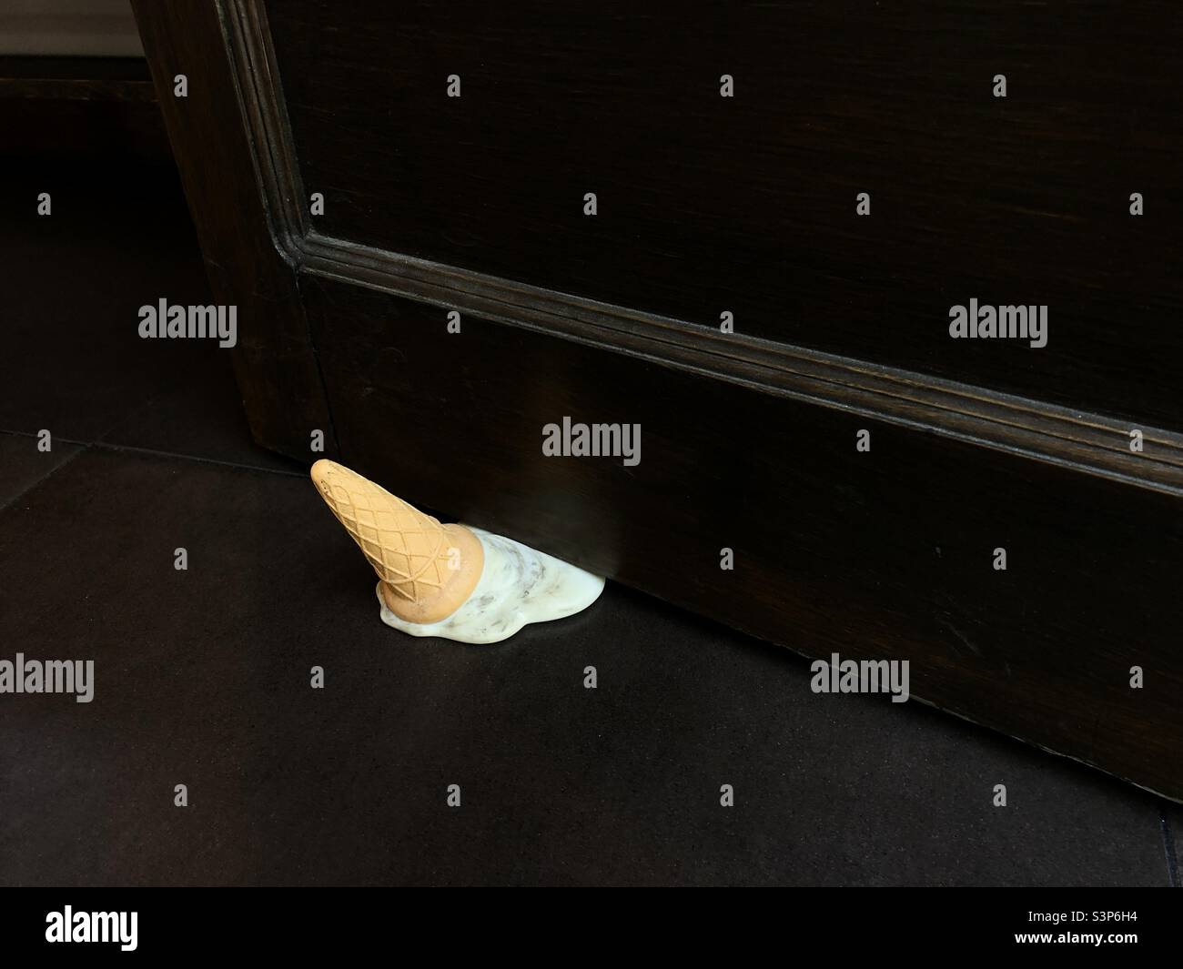 Door stopper in the shape of a Melting ice cream Stock Photo - Alamy