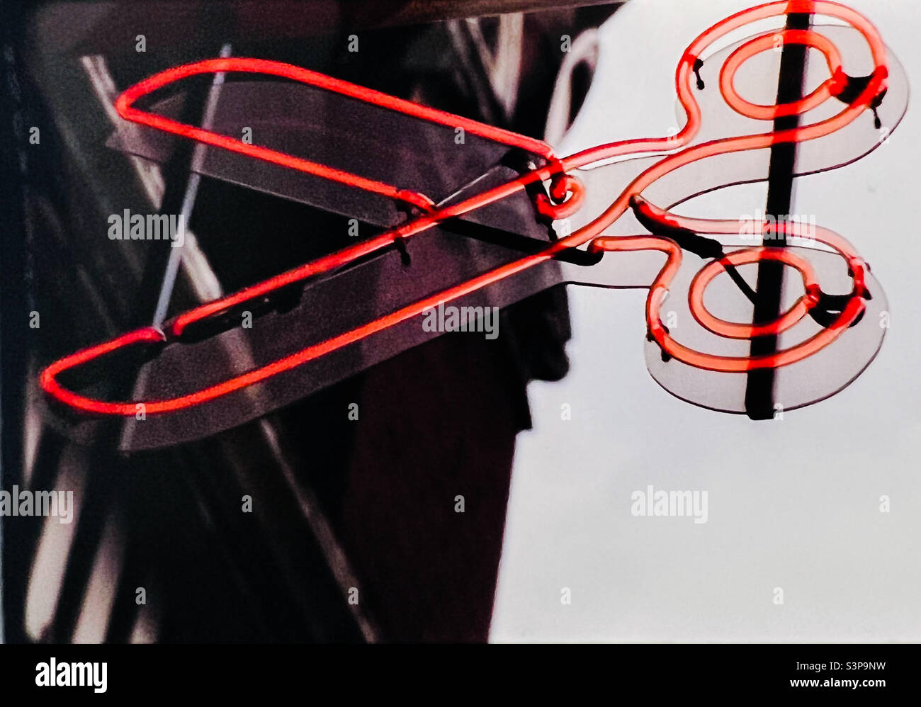 Neon scissors sign outside Hair salon England Stock Photo - Alamy