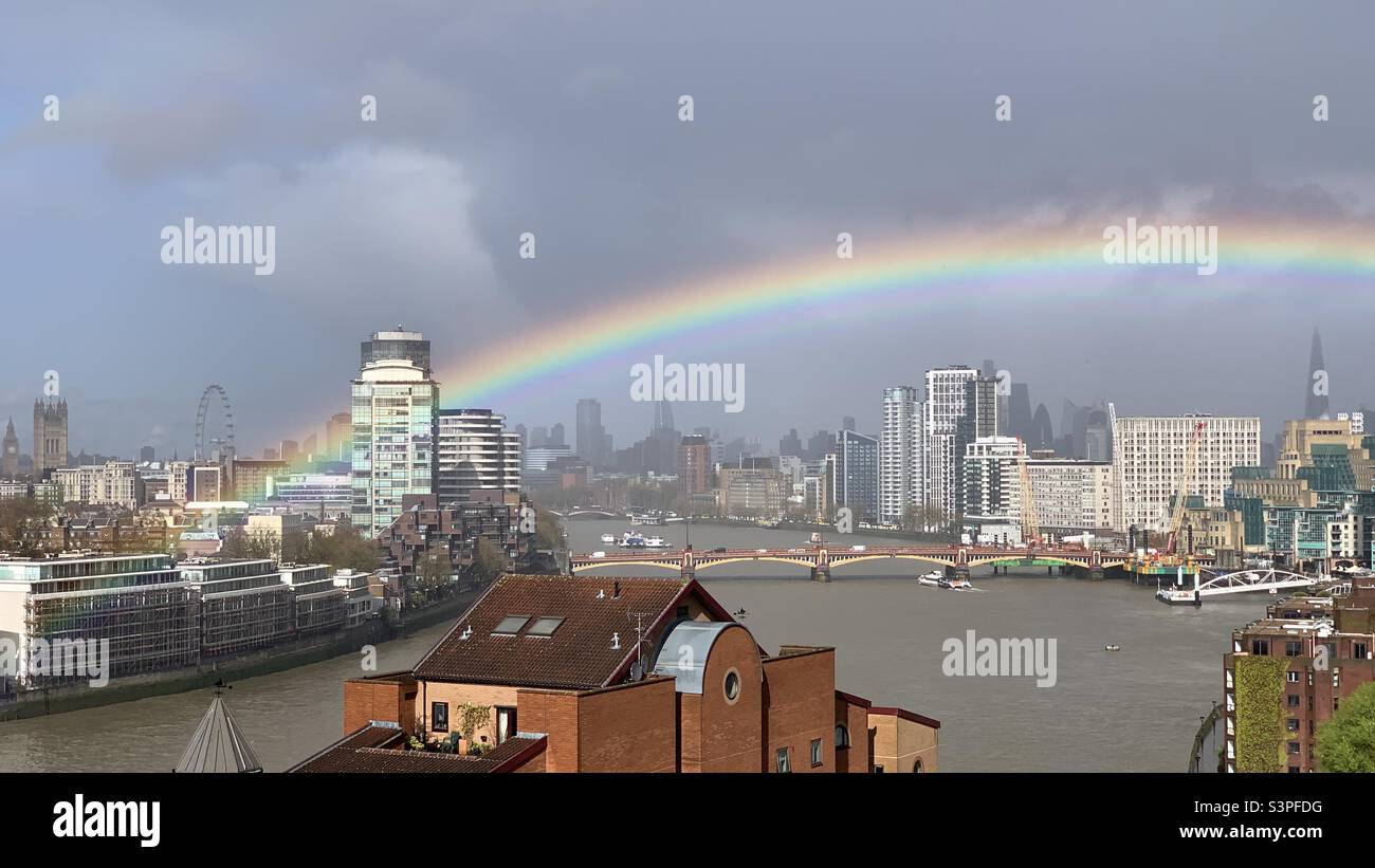 Storms over London leave incredible rainbow over the Thames Stock Photo ...