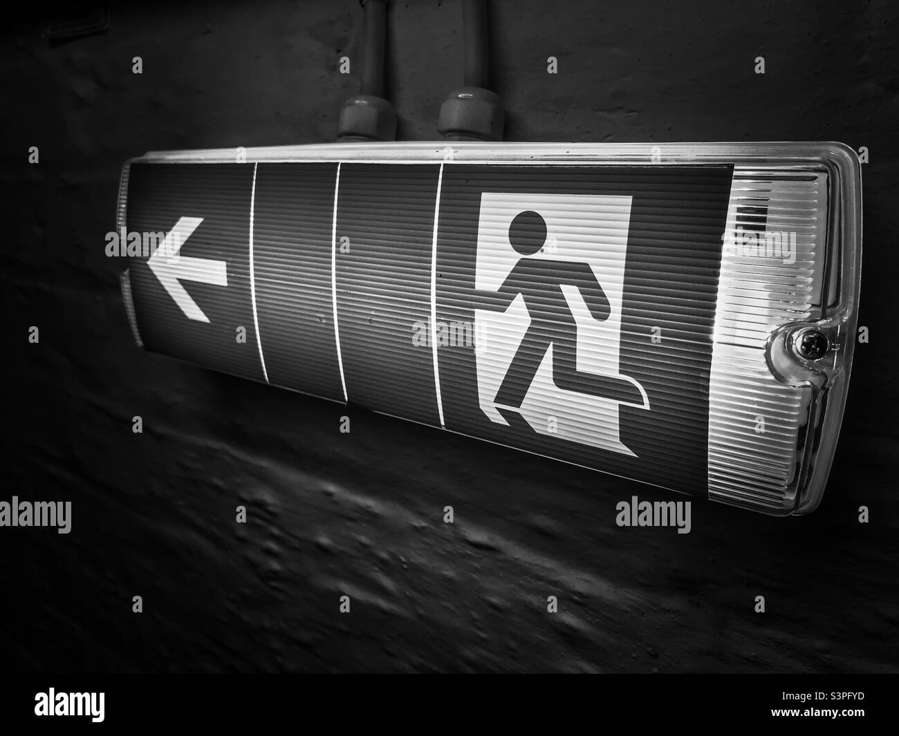 Fire exit sign Stock Photo - Alamy