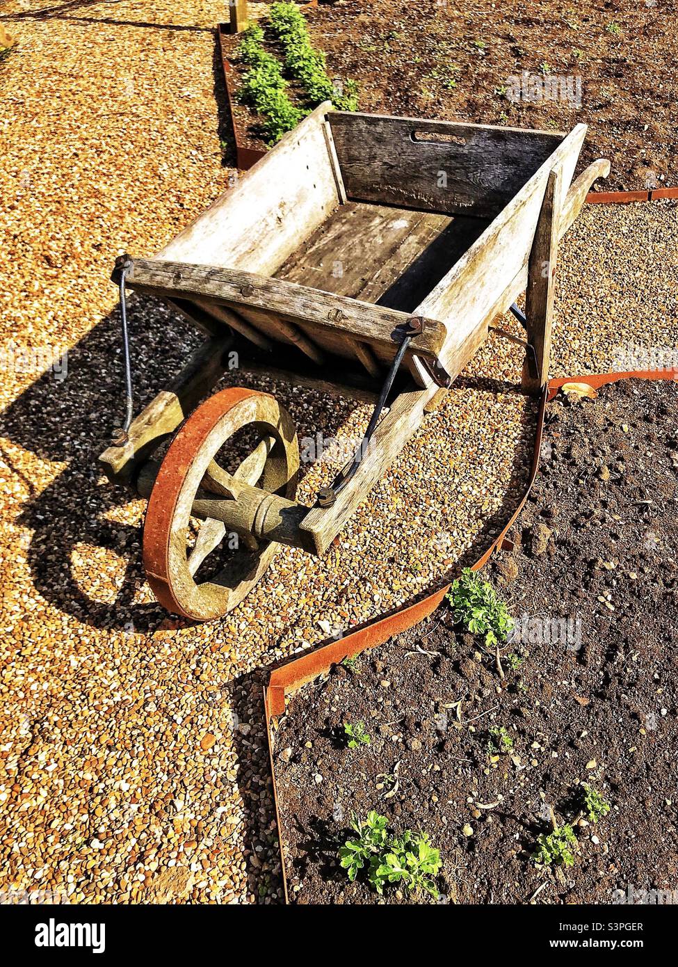 With traditional wooden wheelbarrow hi-res stock photography and images ...
