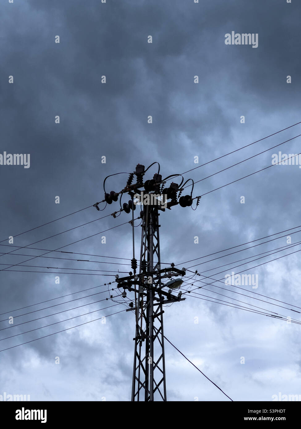 Electricity pylon against dark sky hi-res stock photography and images ...
