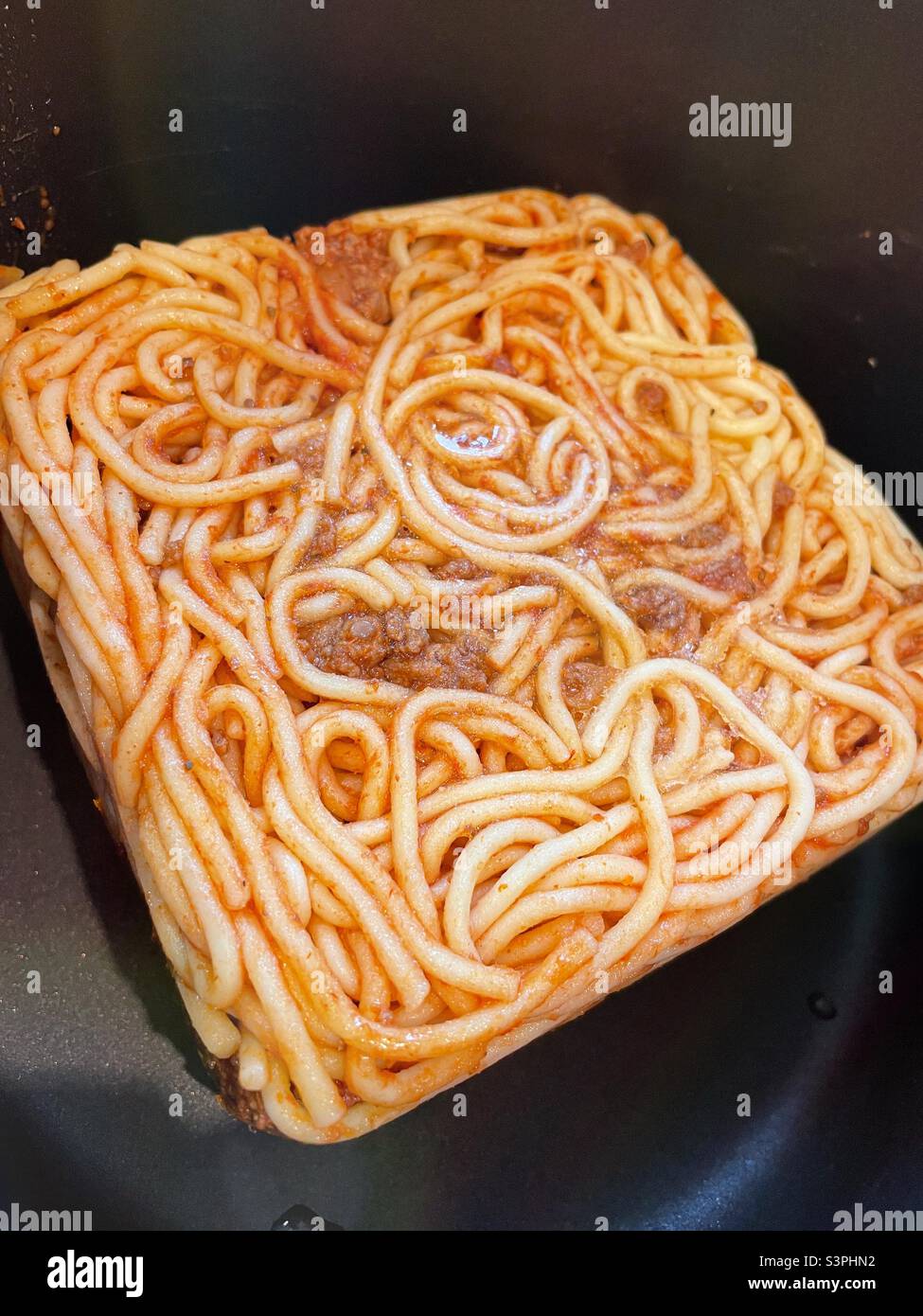 A frozen block of leftover spaghetti and meat sauce, USA, 2022 Stock ...