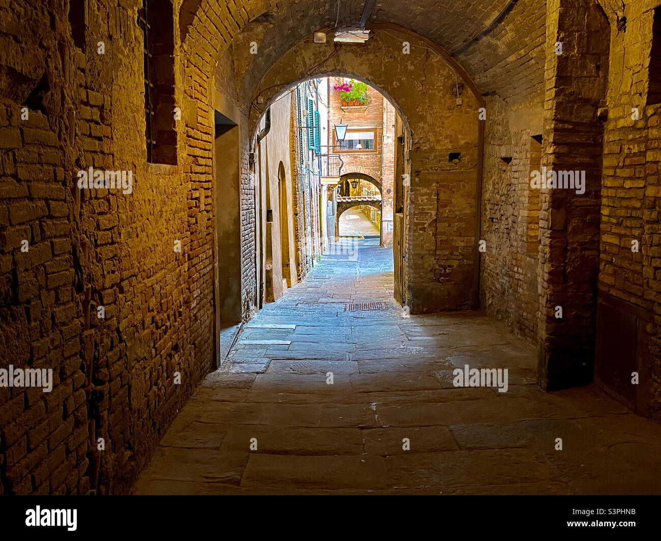 One of the many sheltered small streets in the UNESCO heritage site and ...