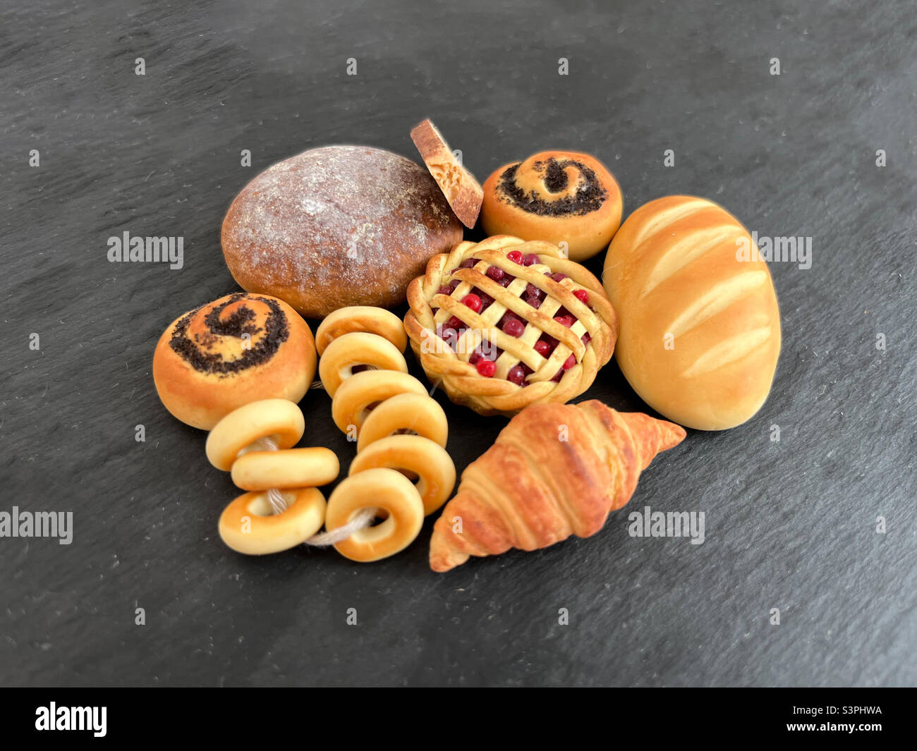 Miniature of bakery pastries in close-up on an isolated background ...