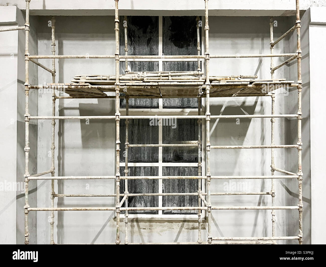 Customized scaffolding on windows for plastering walls. Finishing ...