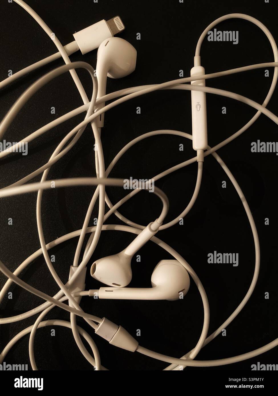 Tangled earphones hi-res stock photography and images - Alamy