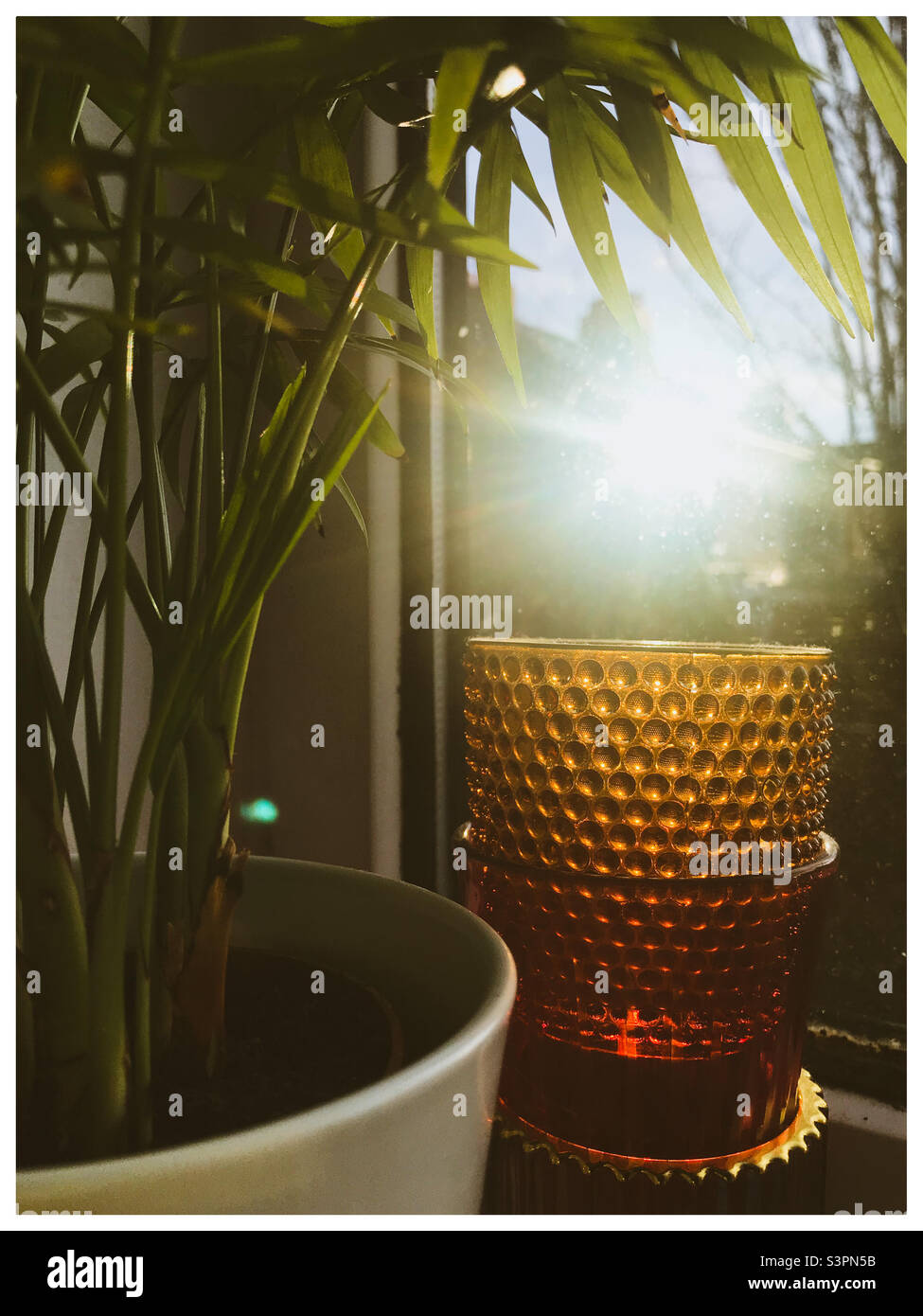 Sunrise through a window Stock Photo - Alamy
