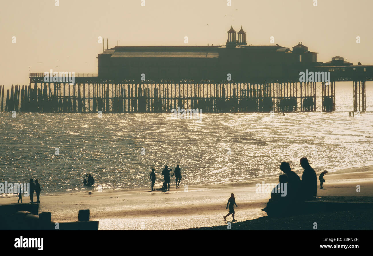 The beach and Hastings pier is hazy, hot summer sun - 2008 Stock Photo ...