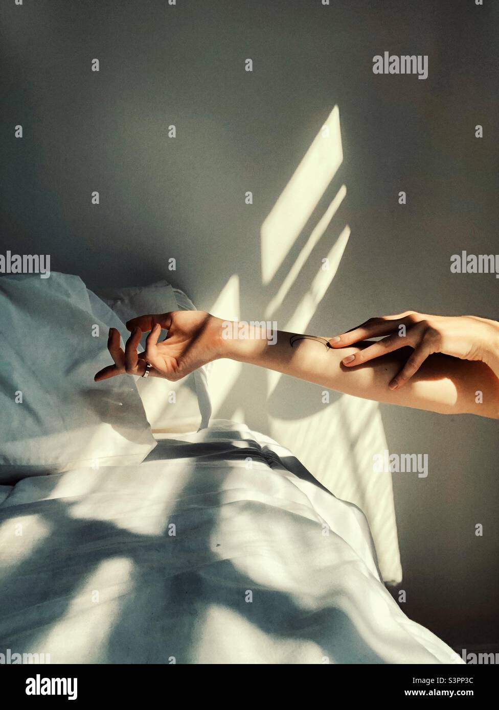 Bed hands hi-res stock photography and images - Alamy