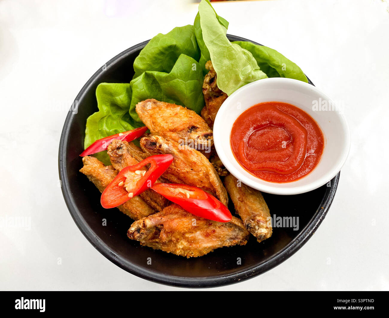 Bowl delicious fried chicken smartphone stock photos and images - Alamy