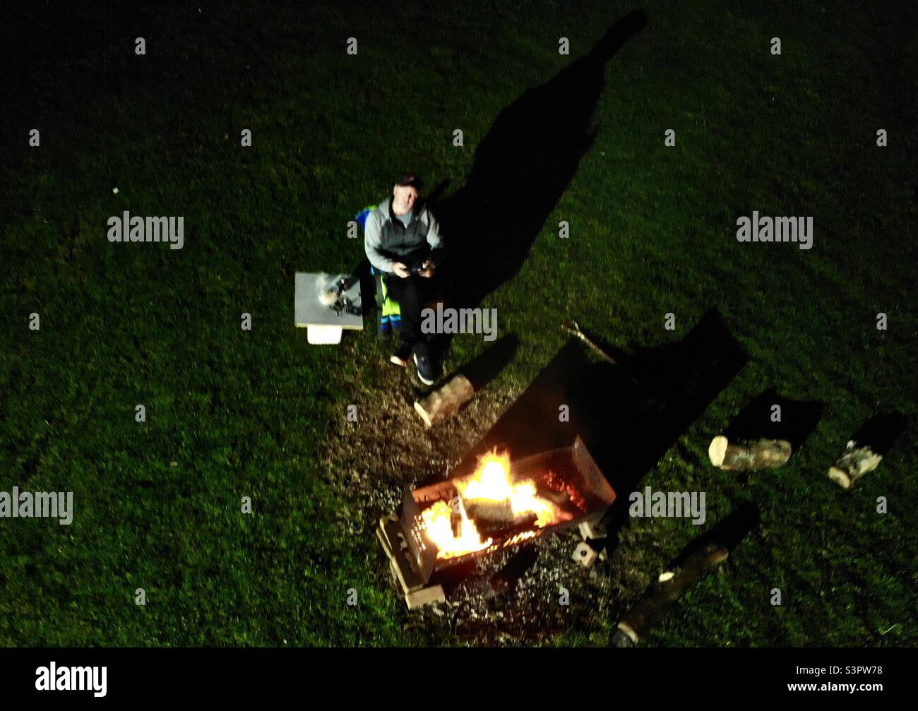 Person sitting by fire hi-res stock photography and images - Alamy