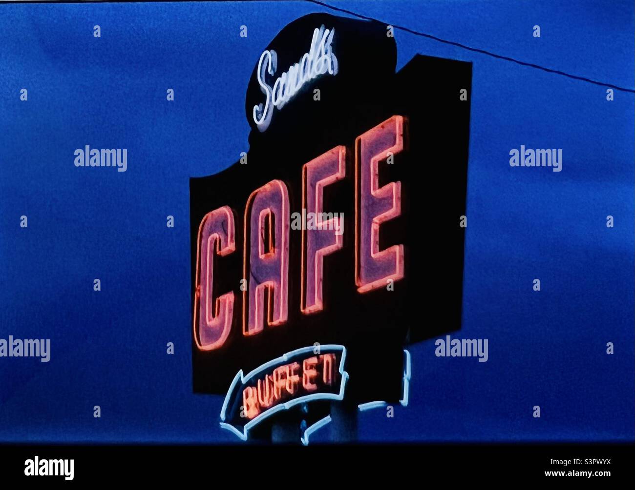 Route 66 Neon cafe sign on American highway Stock Photo - Alamy