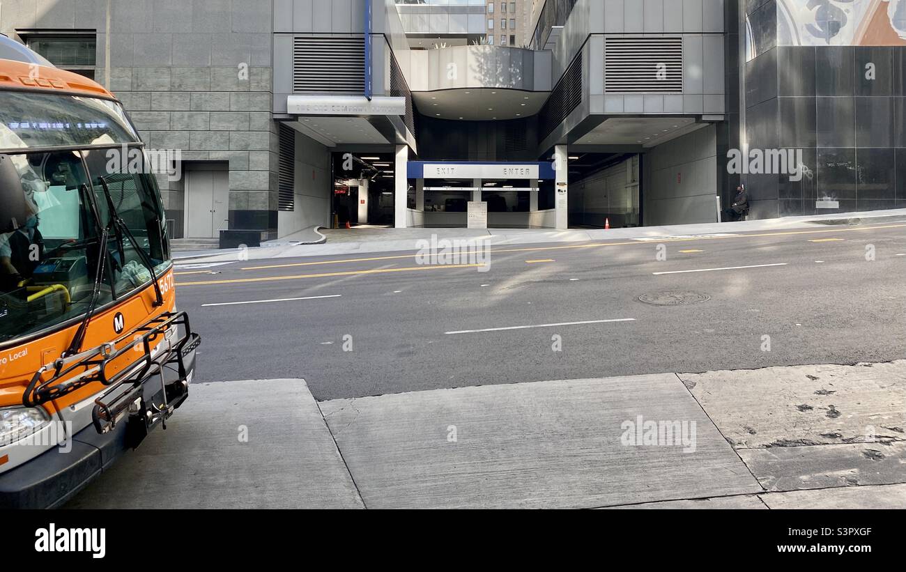LOS ANGELES, CA, APR 2021: LA Metro bus at side of frame, across street ...