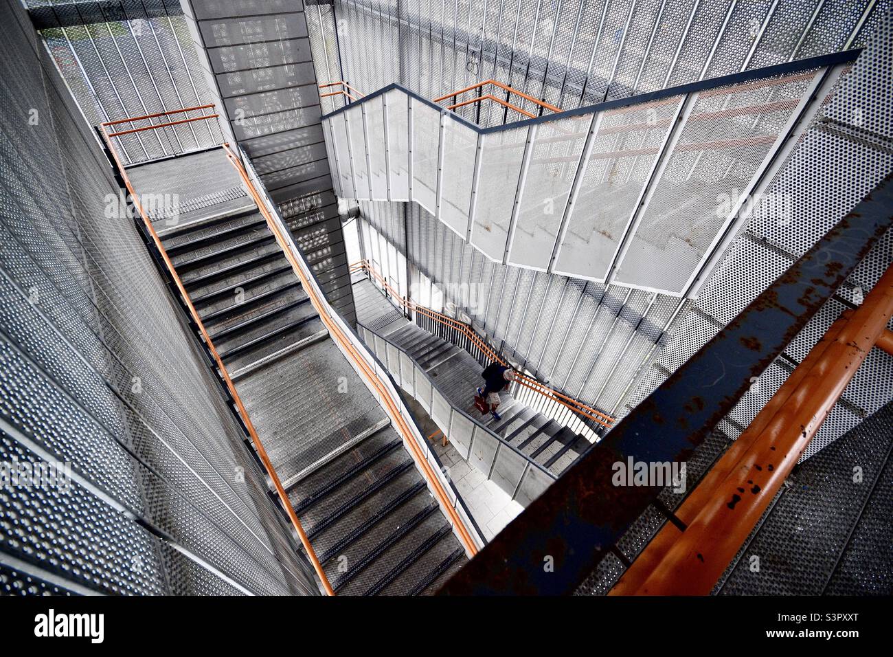 Steel cage holding a spiral staircase at train station Stock Photo - Alamy