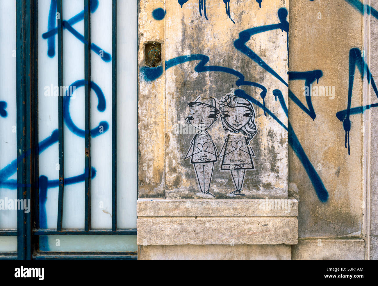 Stencils of Maria and Luís show their hearts amid the graffiti Stock ...