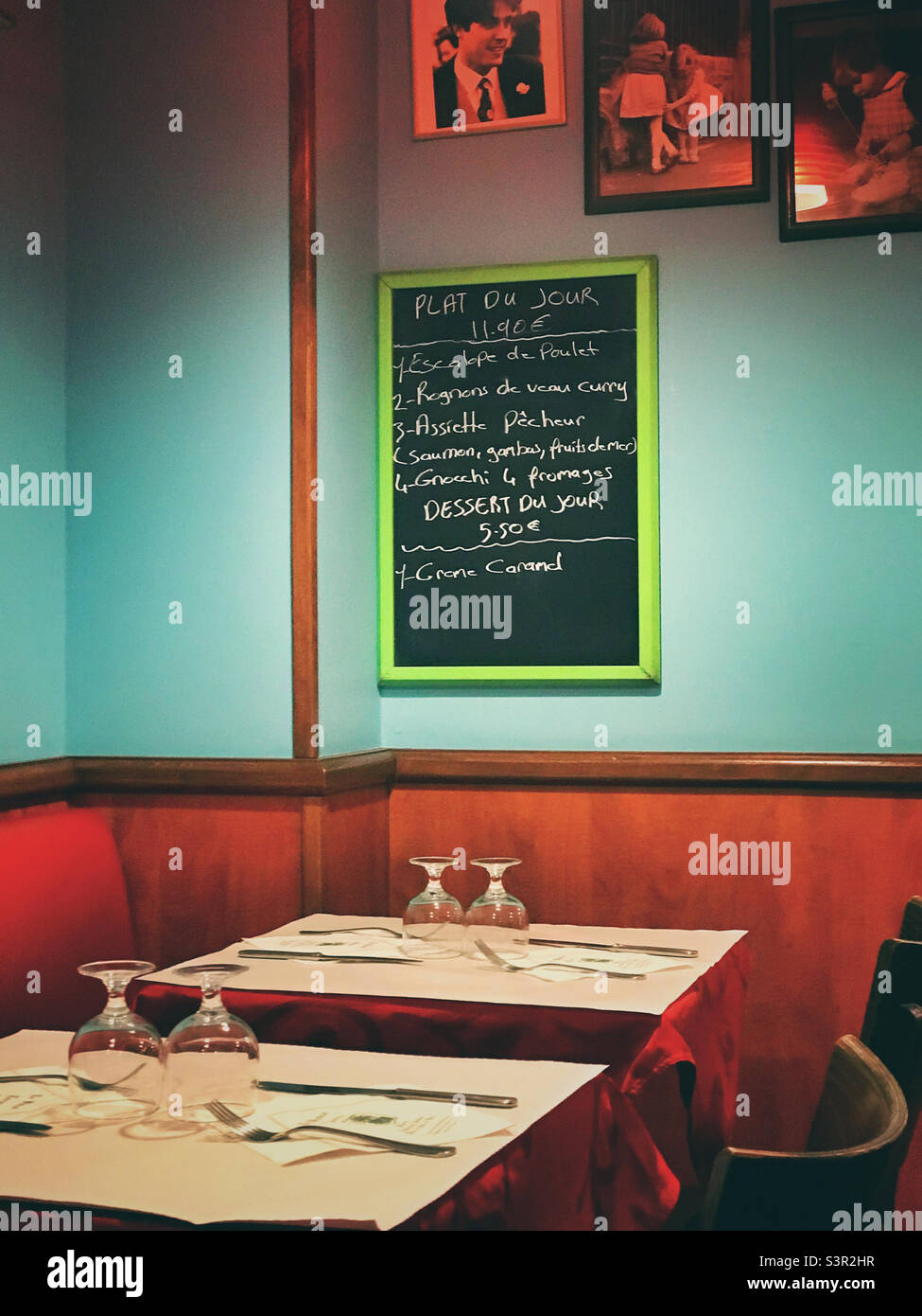 A typical French restaurant in Paris with a “Plat du Jour” menu on ...