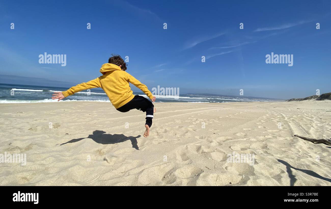 Child jump sand hi-res stock photography and images - Alamy