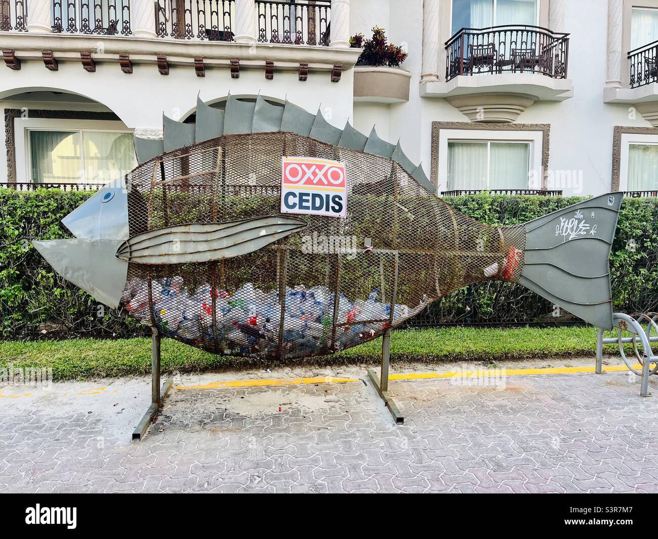 Fish shaped recycling bin for plastics Stock Photo - Alamy