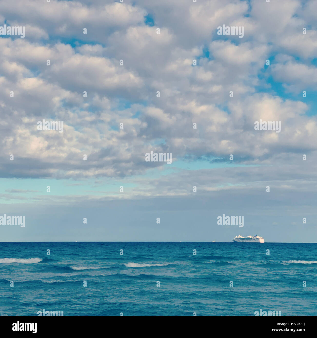 A view of the ocean, with a cruise ship in the distance, Miami Beach ...