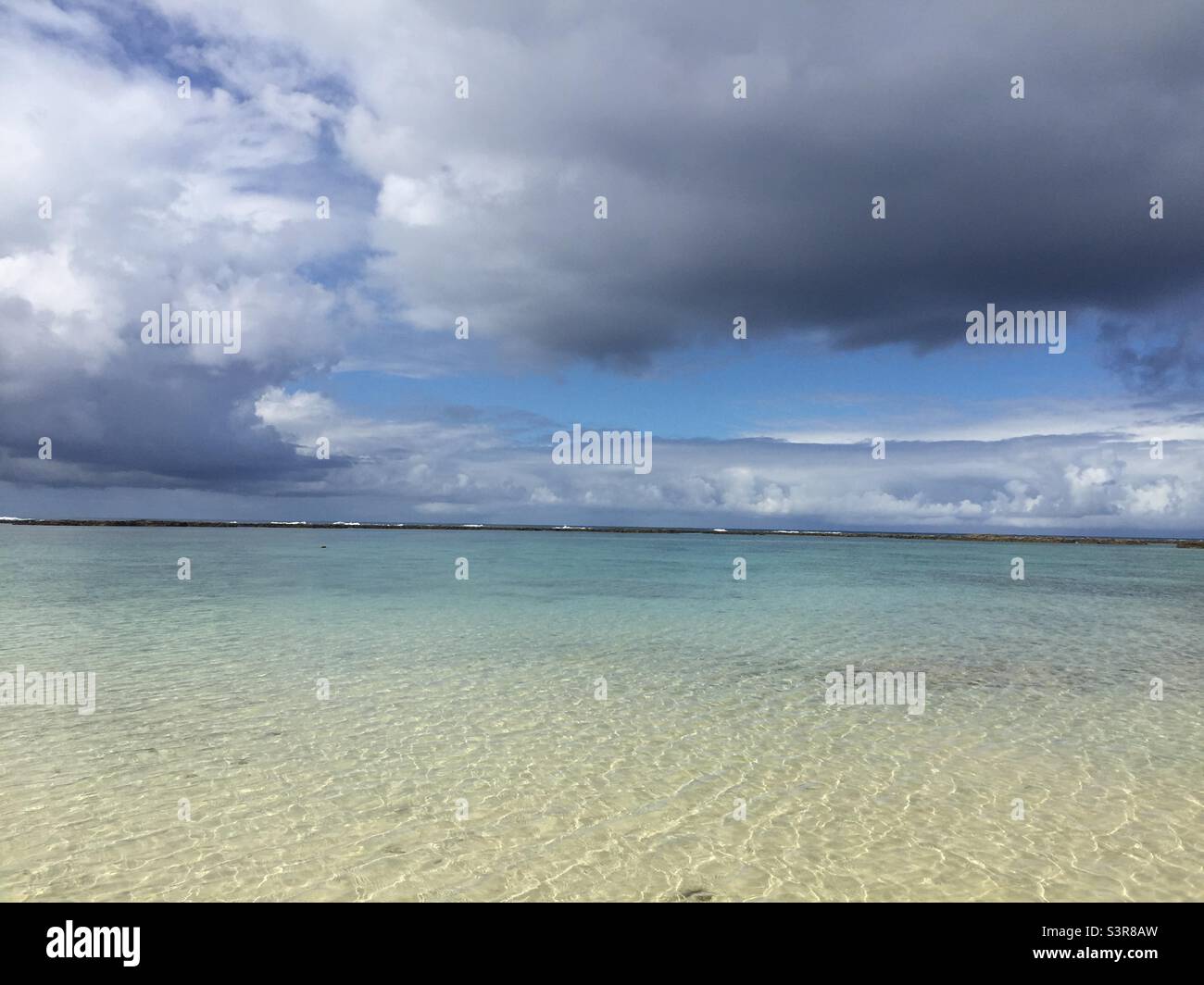 Clear and calm sea on a partly cloudy day. Yonama Beach, Tokunoshima ...