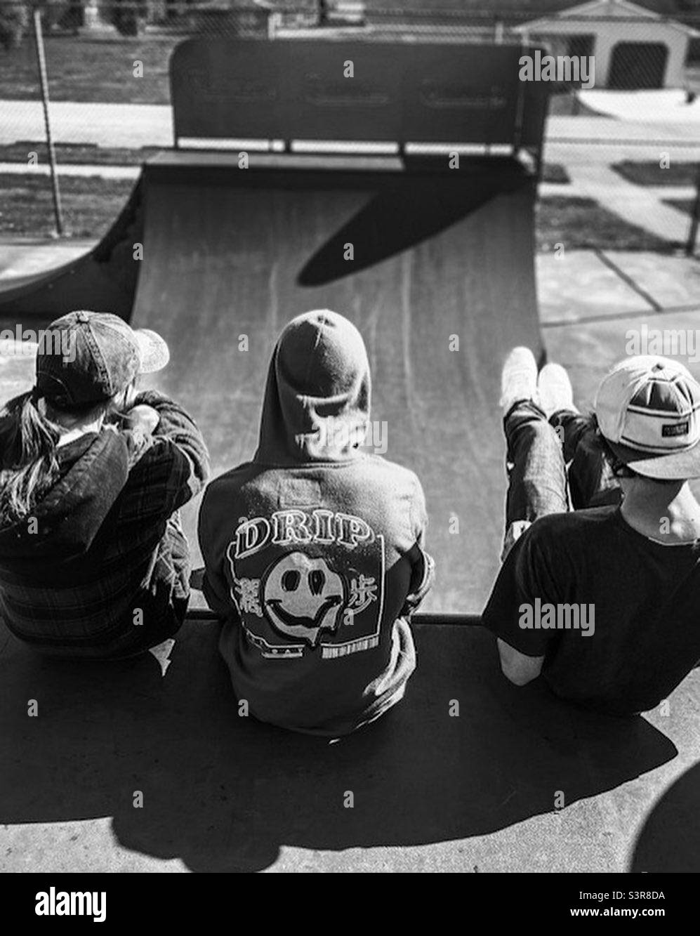 Best friends hanging out at the skatepark together Stock Photo - Alamy