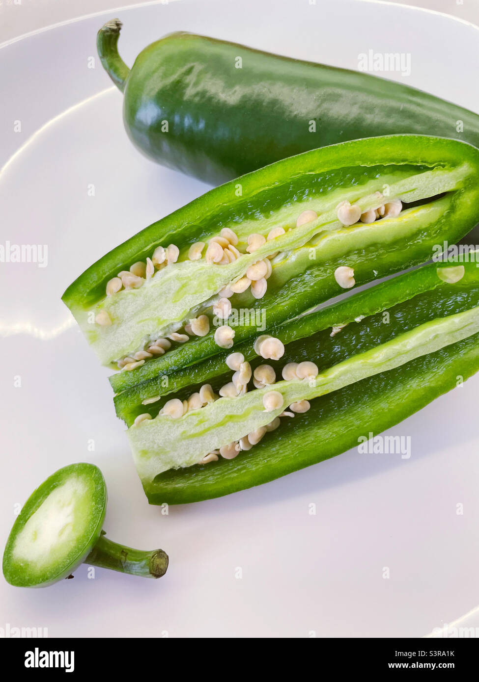 Close up of jalapeño peppers one whole and one sliced, 2022, USA Stock ...