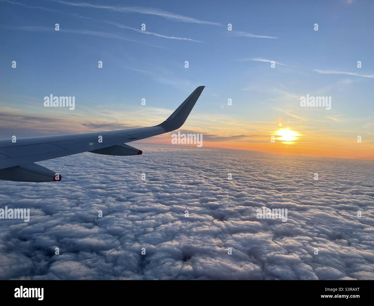 Clouds and sunset by an airplane hi-res stock photography and images ...