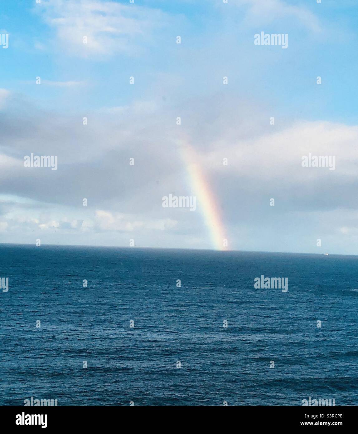 Rainbow in the Sea Stock Photo - Alamy