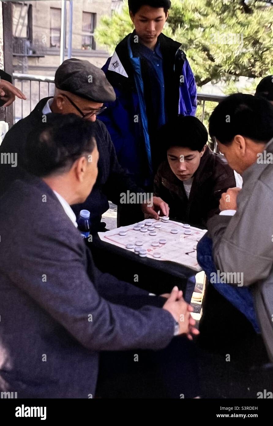 Chinese men of all ages study game playing Chinatown San Francisco ...