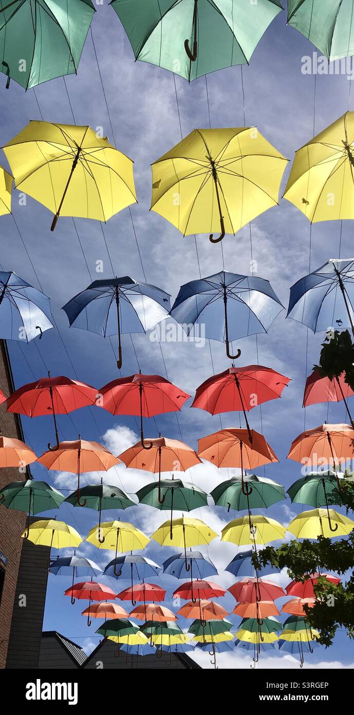 Red yellow blue green umbrella hi-res stock photography and images - Alamy