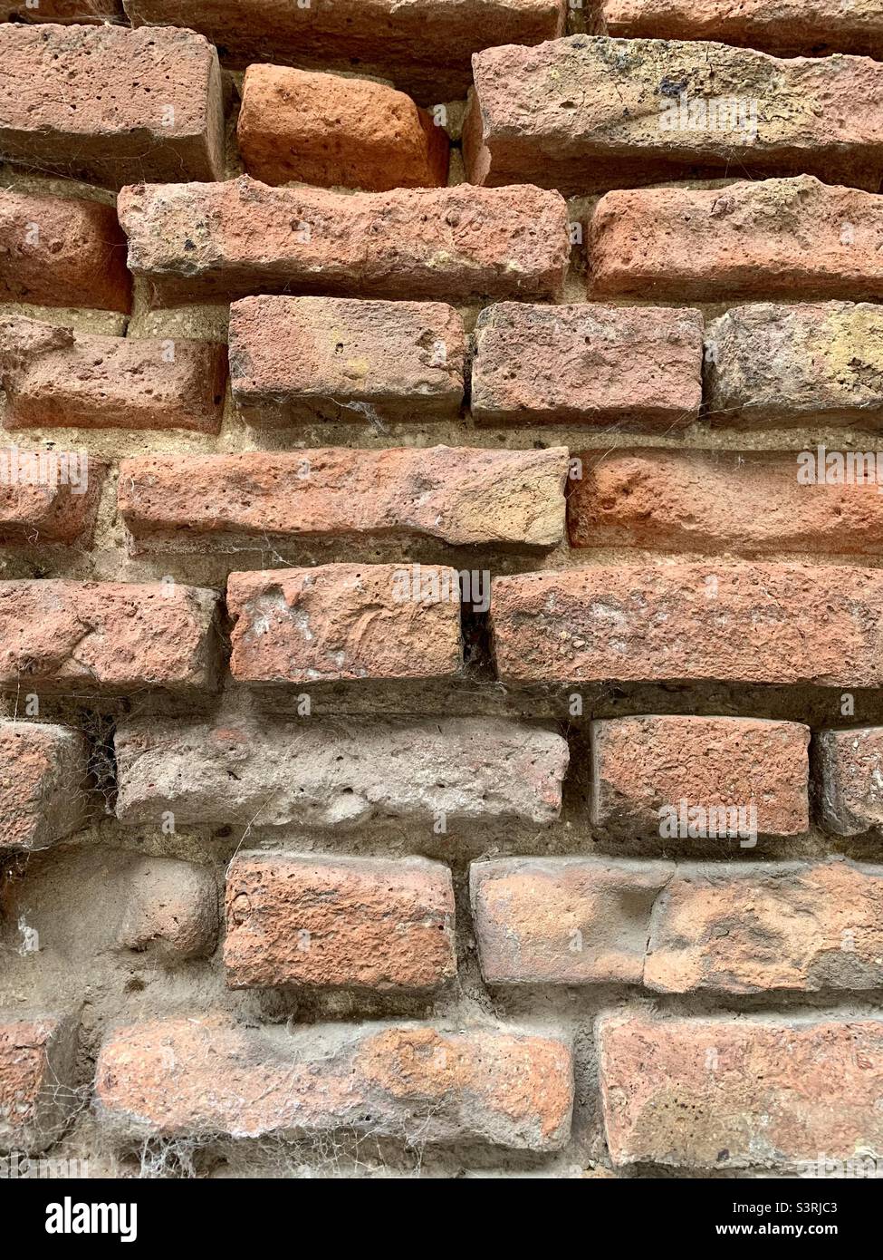 Worn red bricks. 17th century 2 inch bricks. St Ives Cambs U.K Stock ...