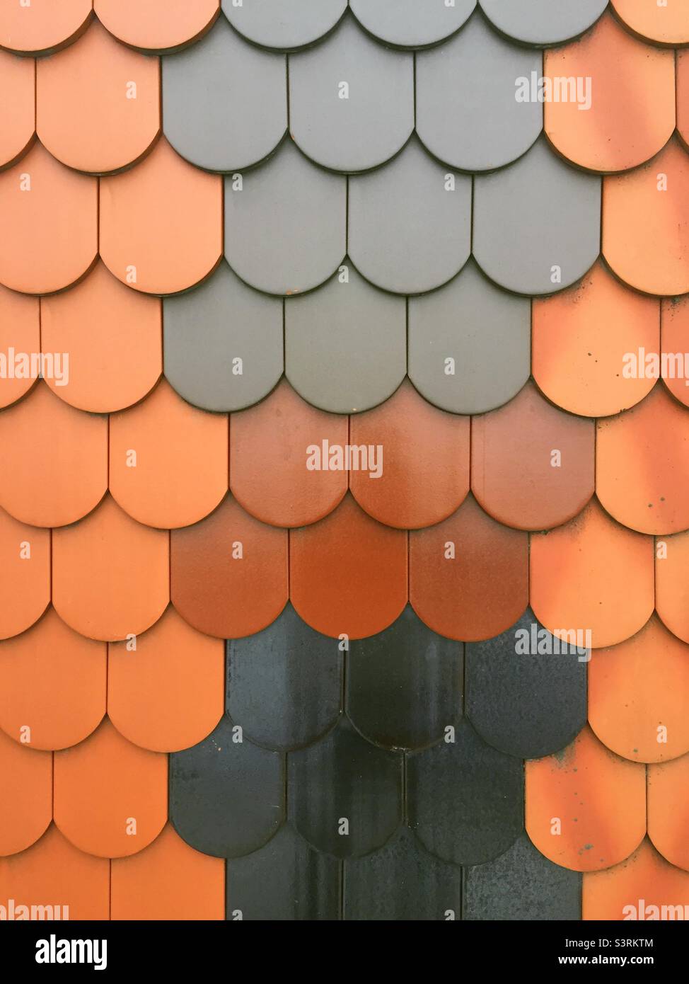 Overlapping roof tiles in various colors Stock Photo - Alamy