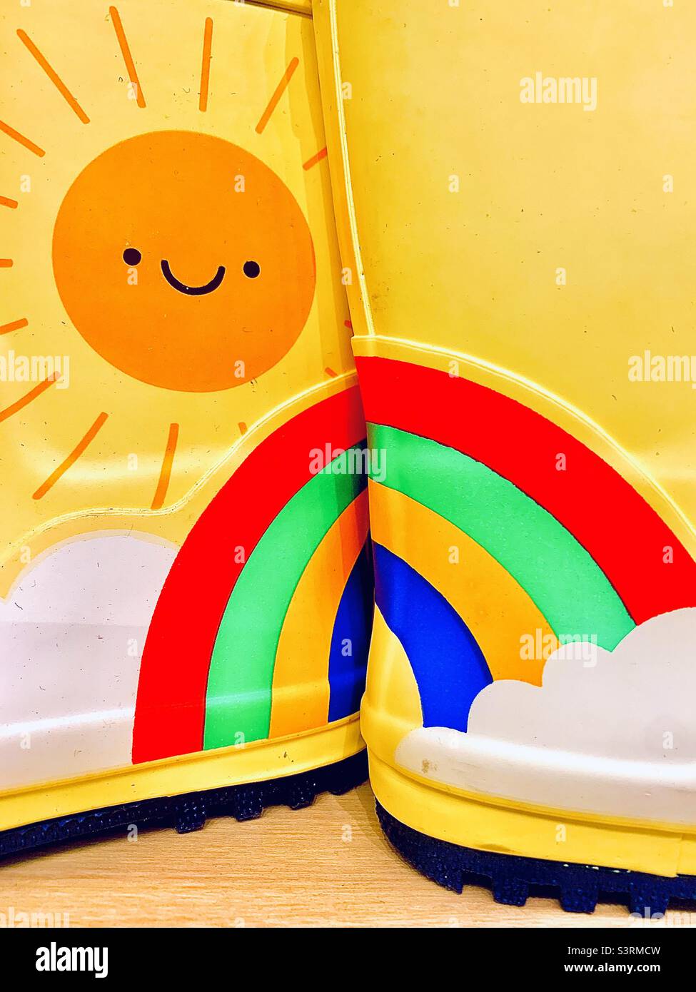 Cheerful children’s rainbow rain boots Stock Photo - Alamy