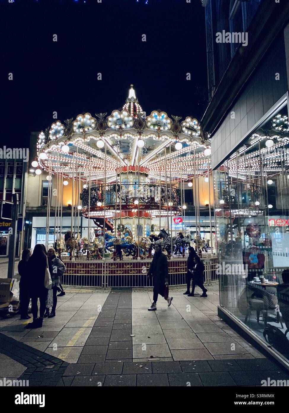 Carousel at night in Cardiff city centre Stock Photo - Alamy