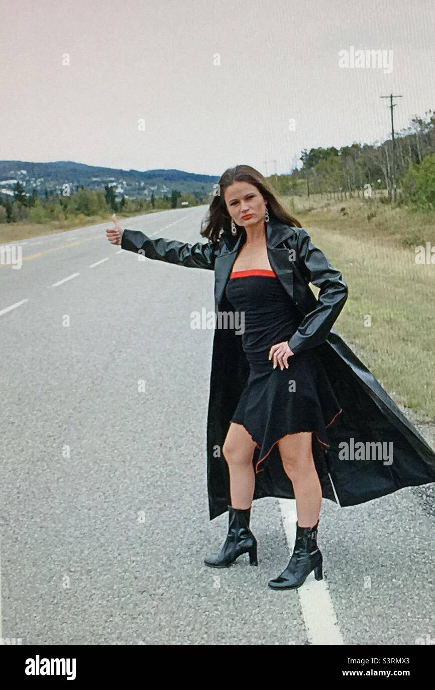 Hitch hiker, woman, pretty girl, Windy day, brunette, thumbing a ride ...