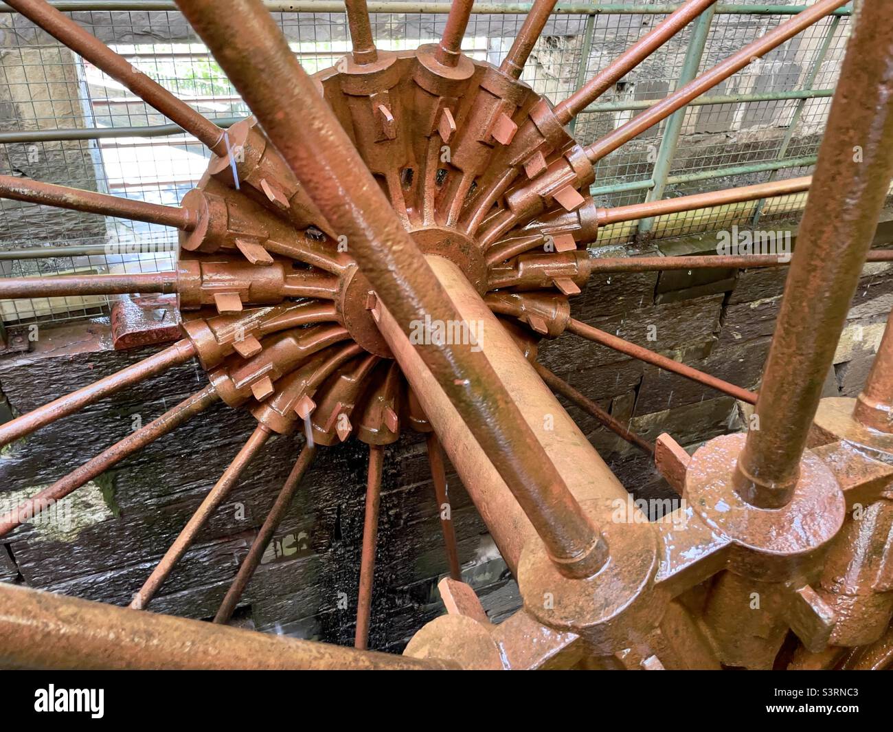 The hub of the giant water wheel in the National Slate Museum in Wales ...