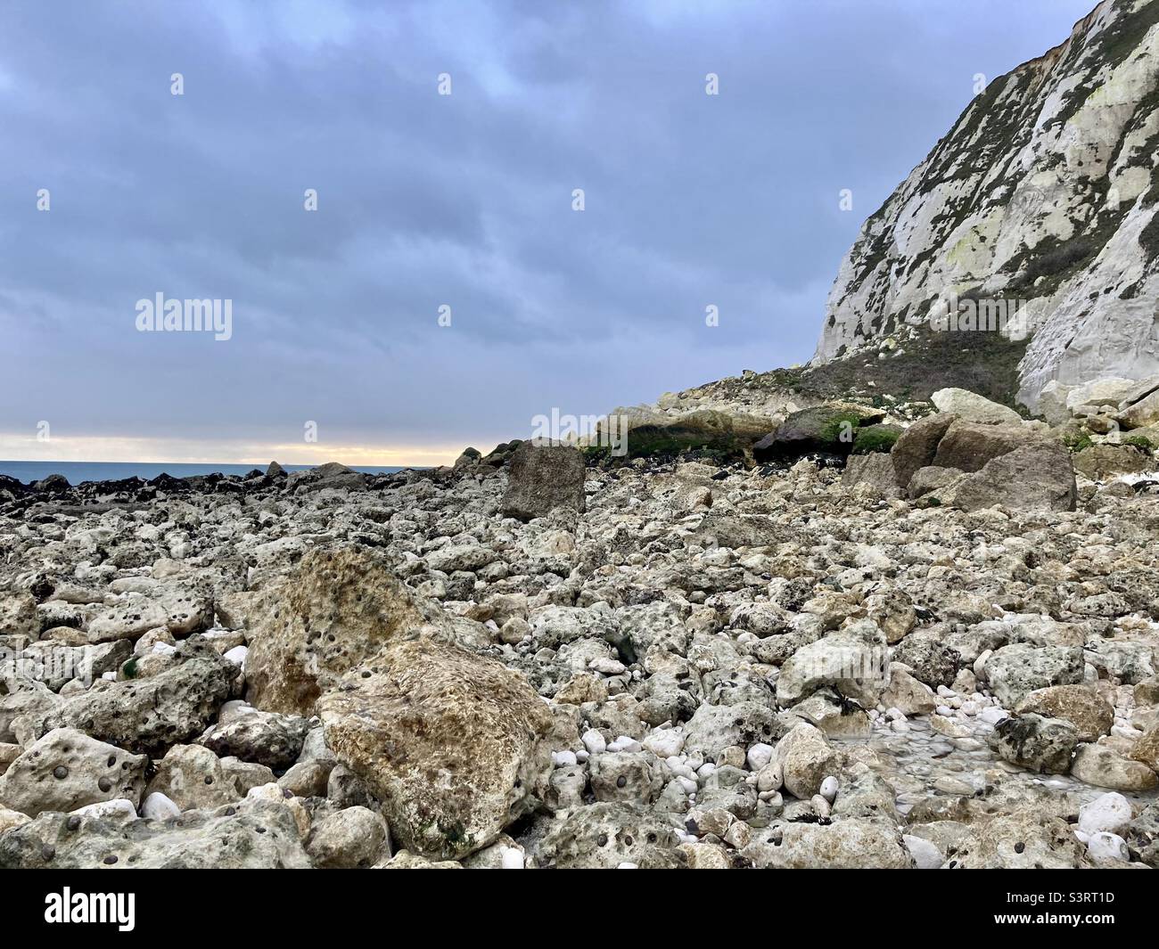Chalk and flint pebbles and rocks on a beach Stock Photo - Alamy