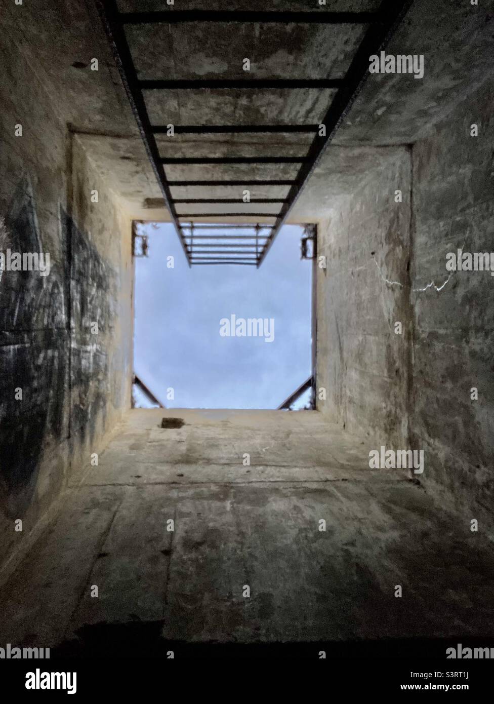 Looking up to the sky from a WW2 escape hatch in an underground ...