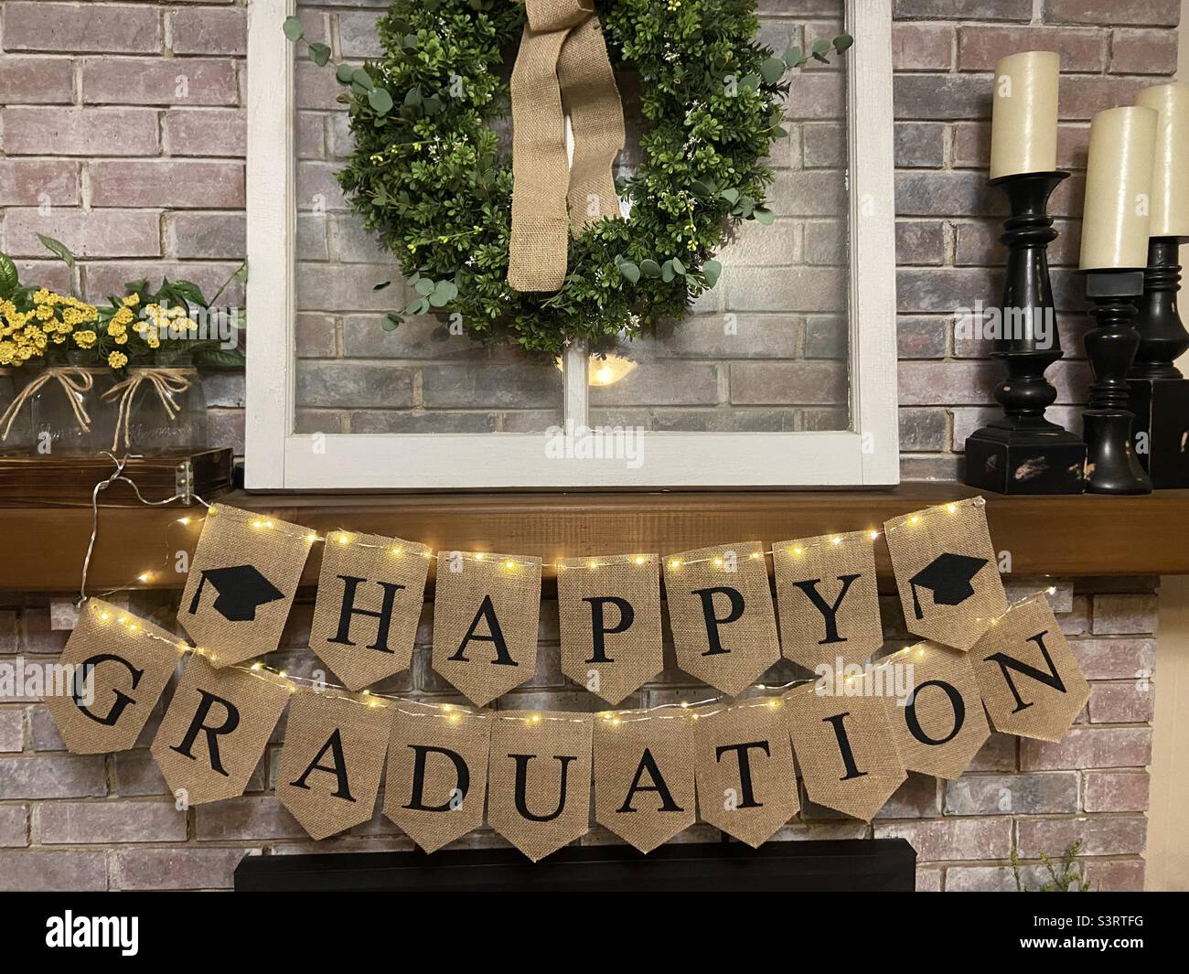 Graduation sign on mantle Stock Photo - Alamy