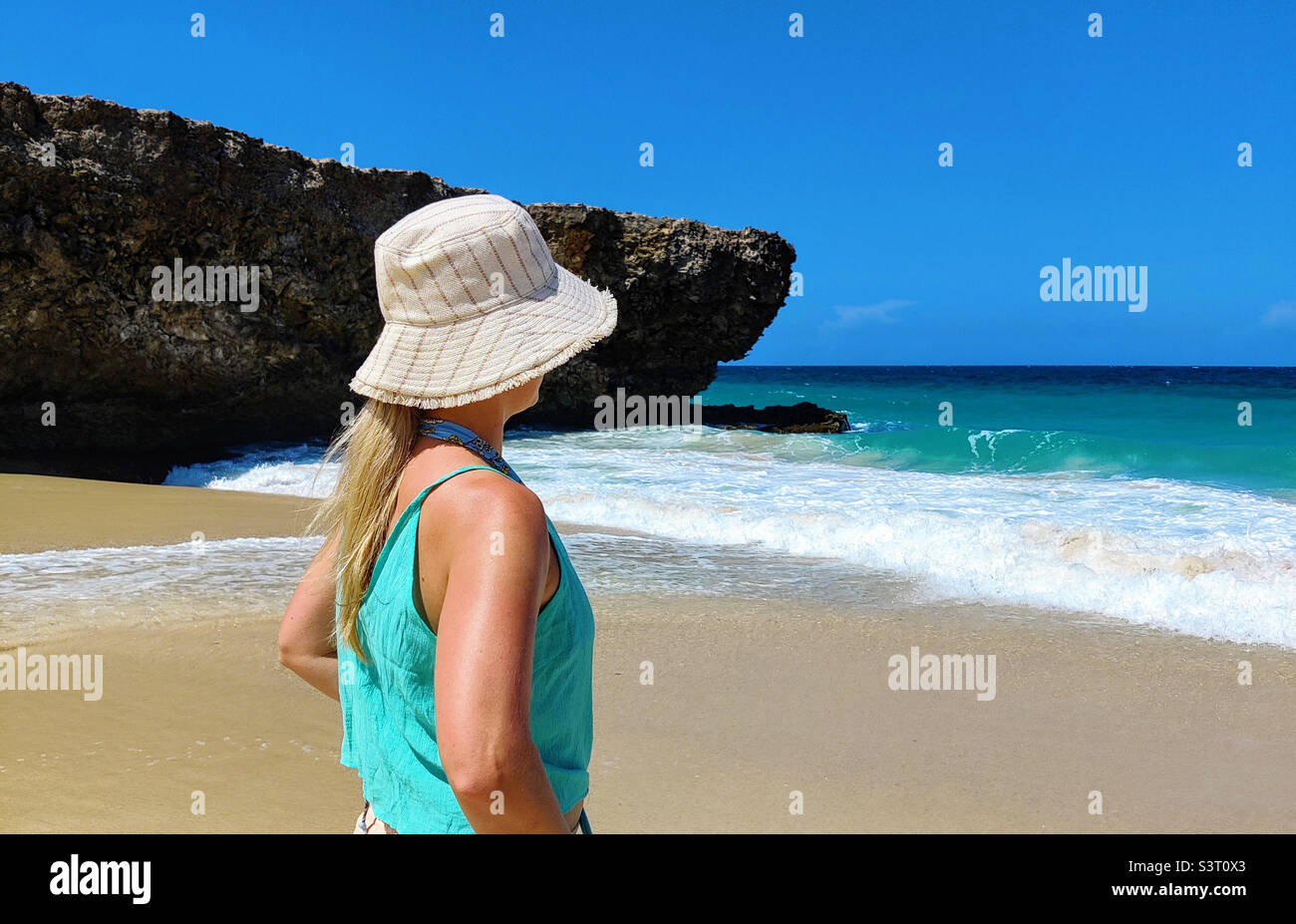 Woman standing beach looking out sea hi-res stock photography and ...