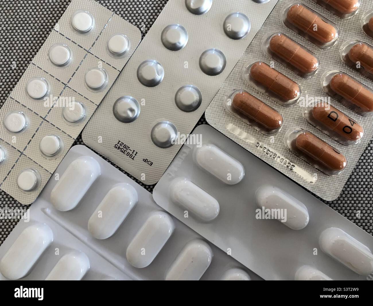 Pills capsules and medicine in packaging Stock Photo - Alamy