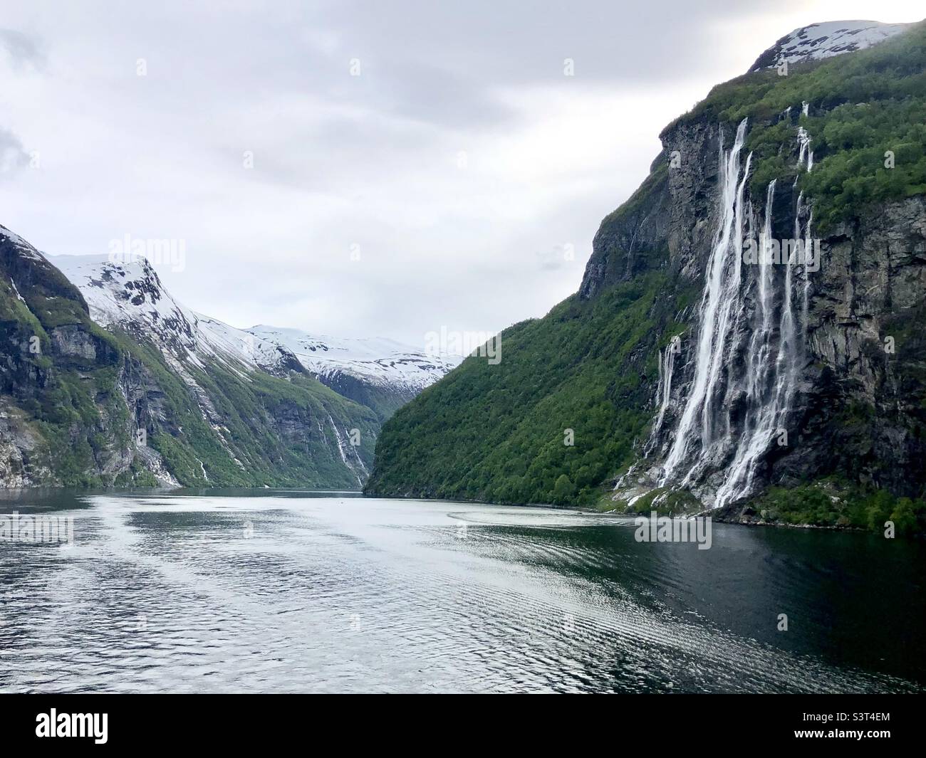 Norwegian fjords snow capped mountains Stock Photo - Alamy