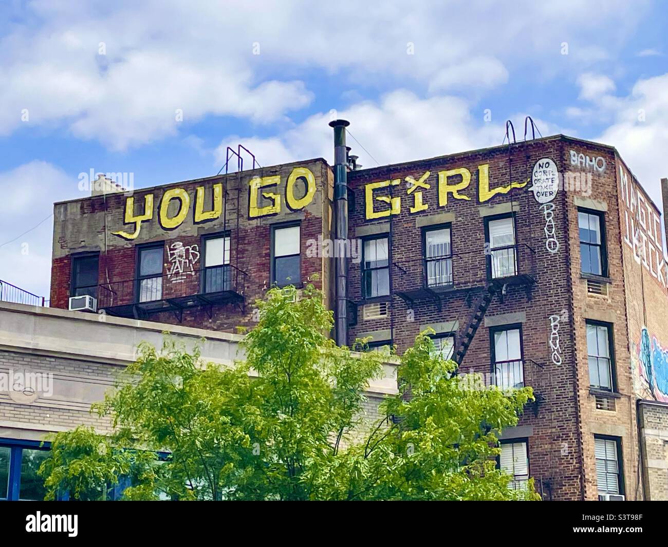 Inspirational message on side of the building in New York City Stock ...