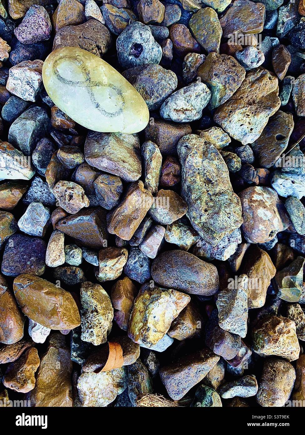 Rock bed including infinity rock in upper left corner Stock Photo - Alamy