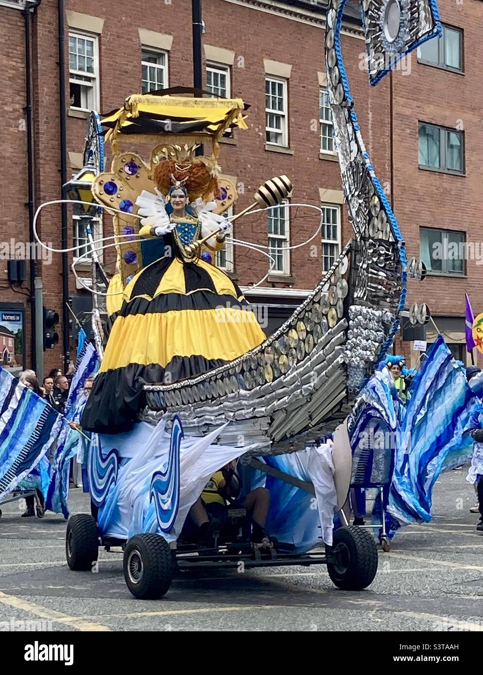 Queen Bee at the Manchester Day parade 2022 on her gondola of upcycled ...