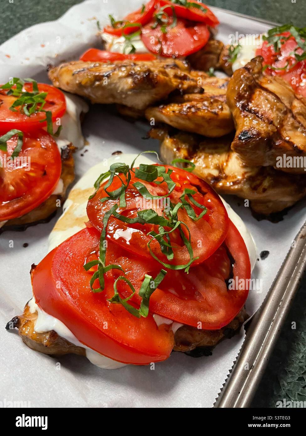 Close up of a gourmet main course entrée, Caprese chicken, 2022, USA ...